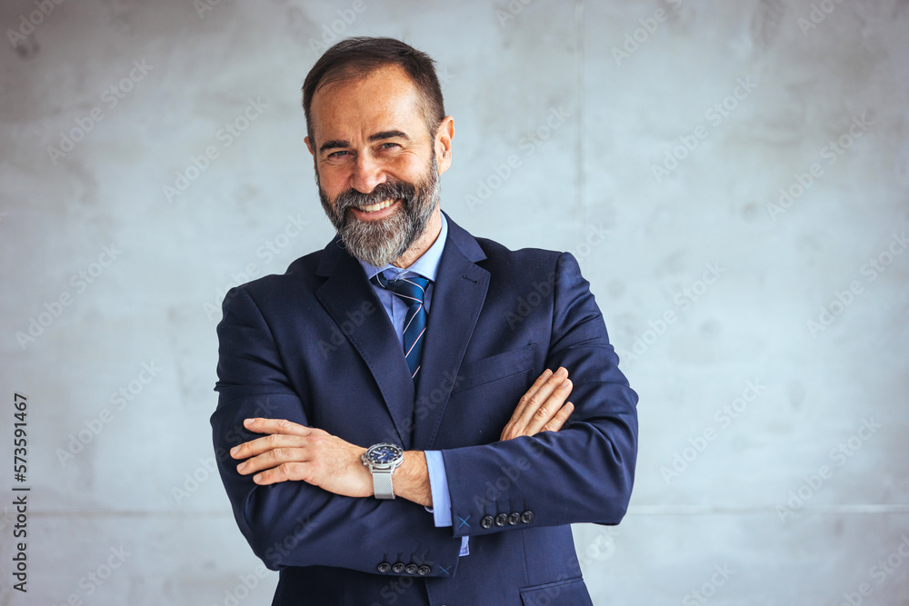 Mature cheerful executive businessman at workspace office. Portrait of ...