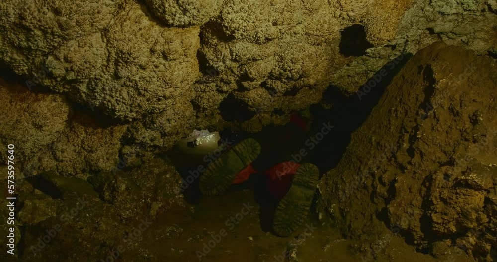 Vídeo do Stock: The cave explorer embark on a dangerous adventure as ...