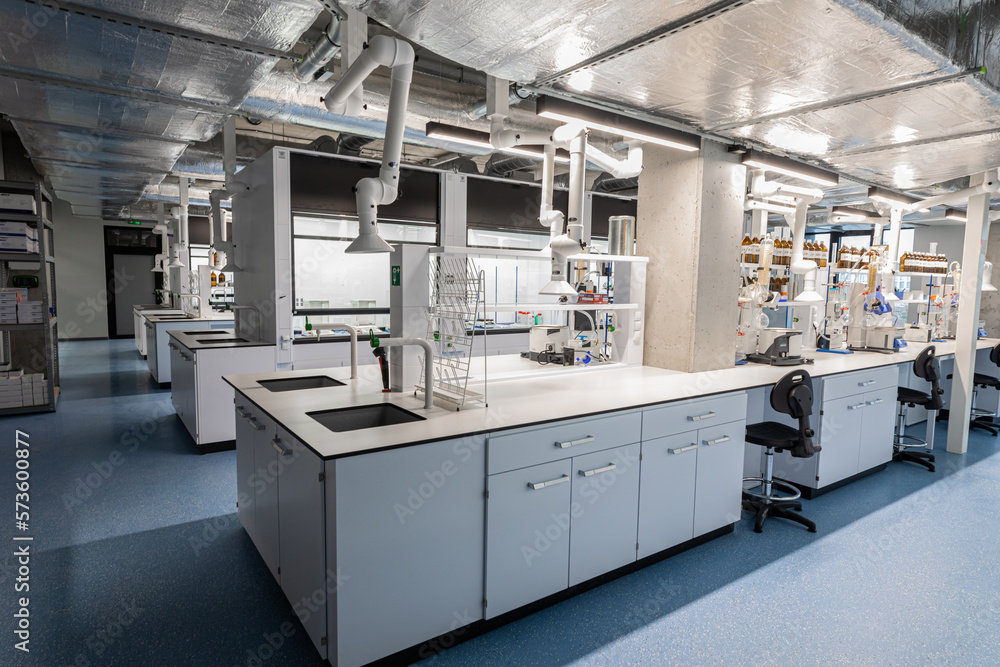 Chemistry lab with white cabinets, chemist workstations and swivel ...
