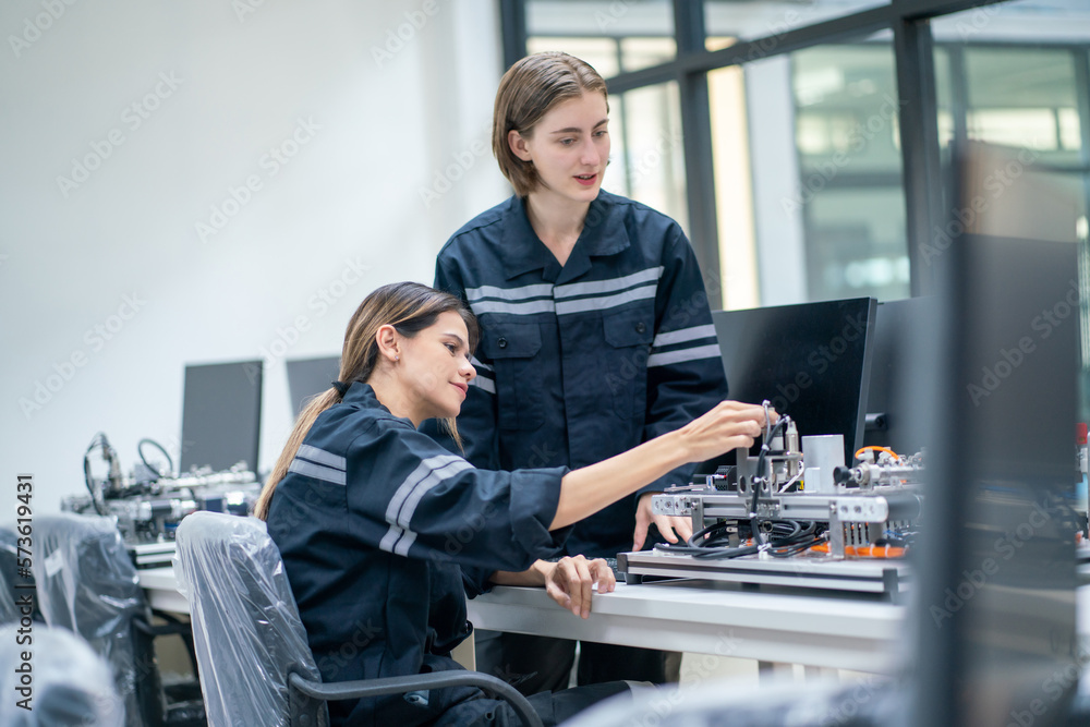 Mechanical engineering team working in robotic technology lap for ...