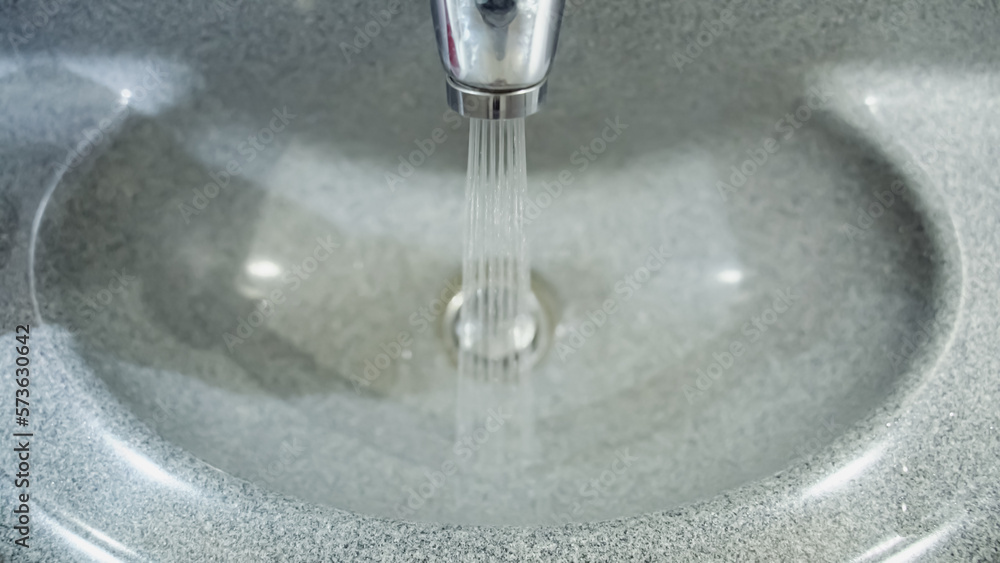 Water flows from the tap in airplane Stock Photo | Adobe Stock