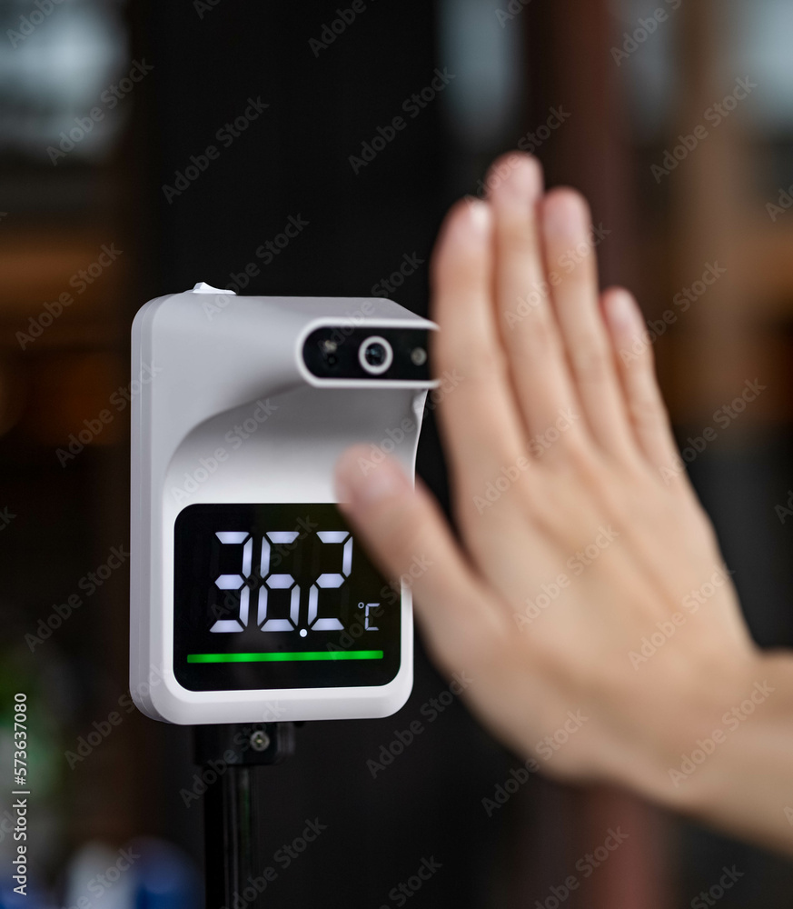 People measure temperature with right hand on sensor before getting ...