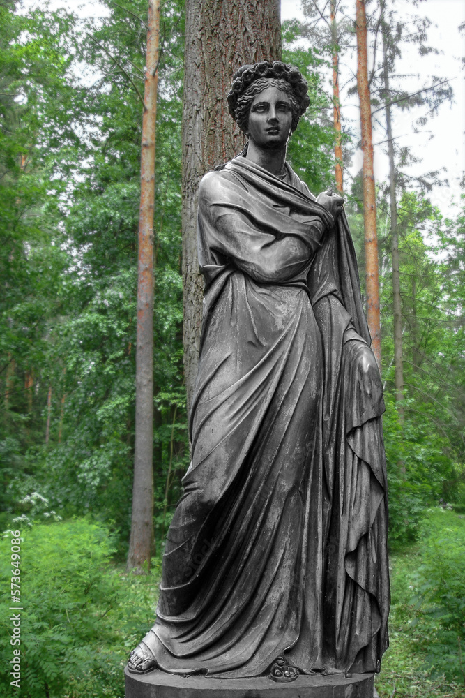 Statue of the Greek goddess Flora in the spring park. Determination ...