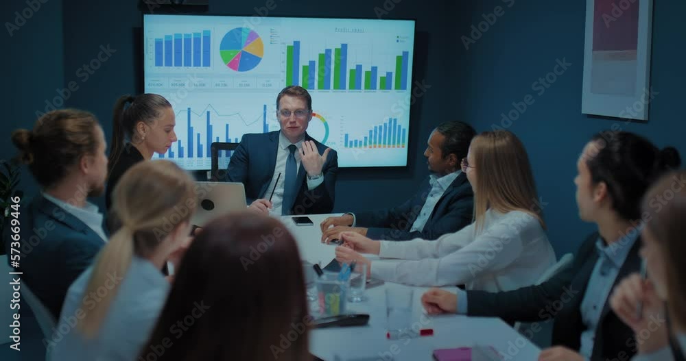 leader of company presenting to employees strategy plan of work ...