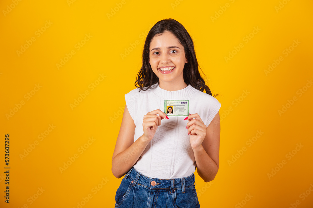 Foto de beautiful brazilian woman holding rg, brazilian identification ...