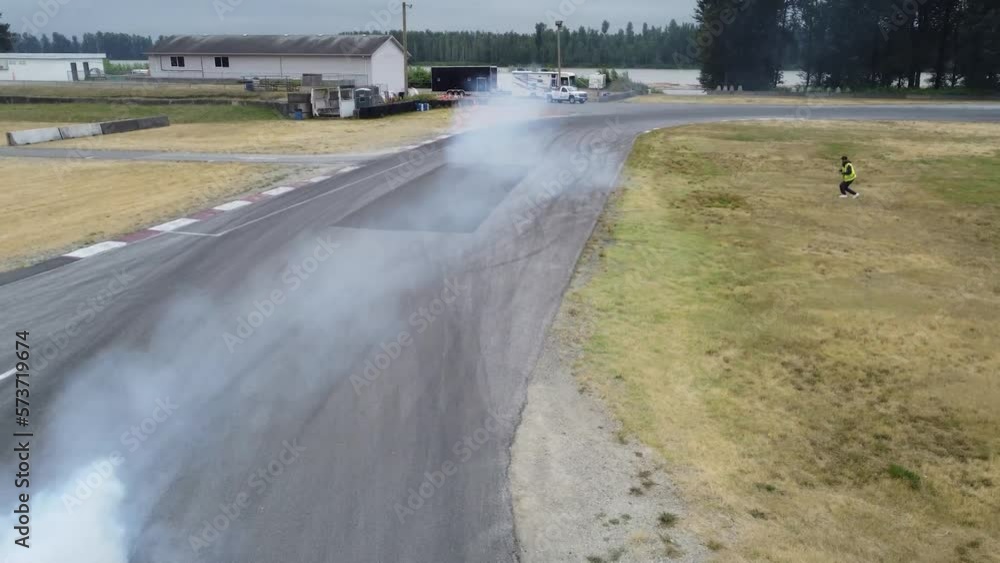 Red Drift Car / Race car drifting around corner very fast with lots of ...