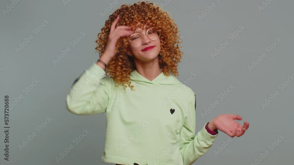 Wow. Hello, welcome. Teenager girl in glasses appear from below waving ...