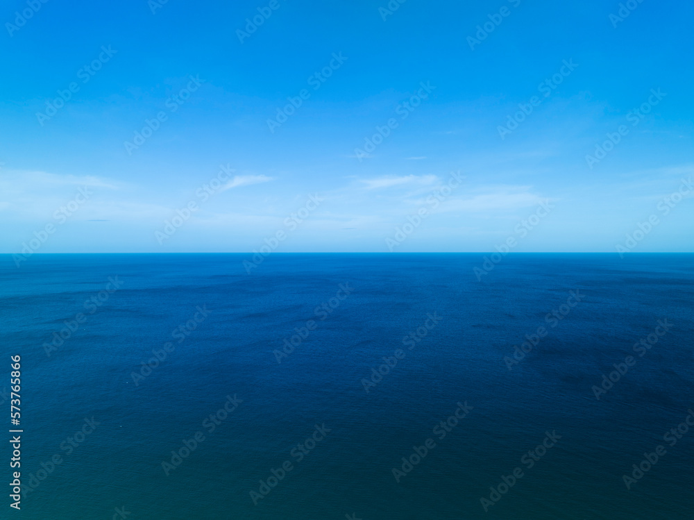Aerial view of a blue sea surface water texture background and sun ...