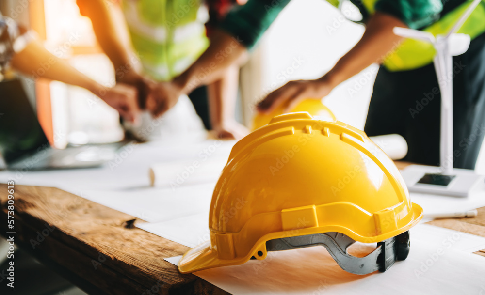 Engineer teams meeting working together wear worker helmets hardhat on ...