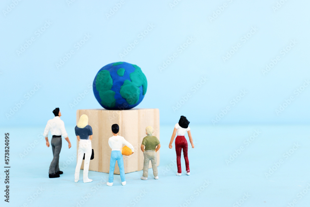 Group of people looking at earth model. Concept of environmental ...
