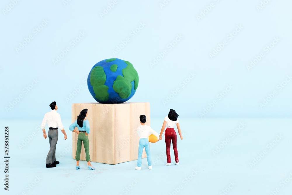 Group of people looking at earth model. Concept of environmental ...