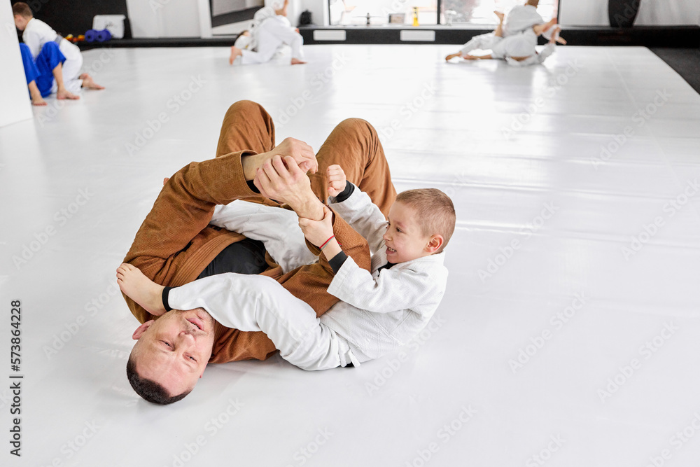 Dynamic portrait of man, professional judo, jiu-jitsu coach training ...