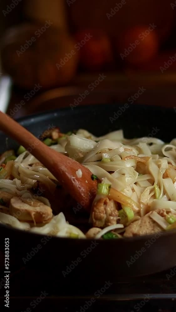 Vertical video of cooking pad see ew or thai stir fried noodles ...