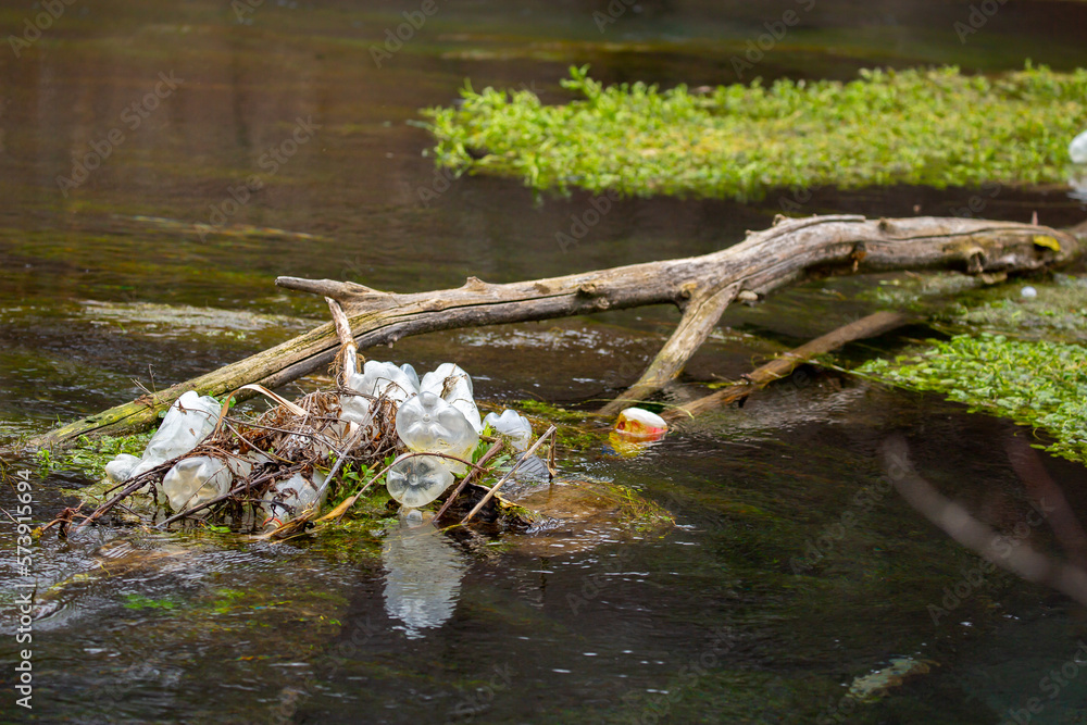 Floating debris in the water. Pollution of the ecology with plastic ...
