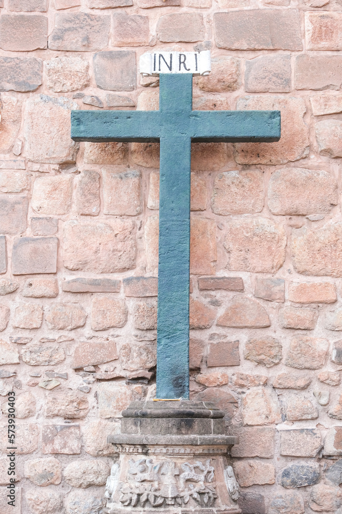 Inri christian cross symbol behind of catedral wall in Cusco Peru ...