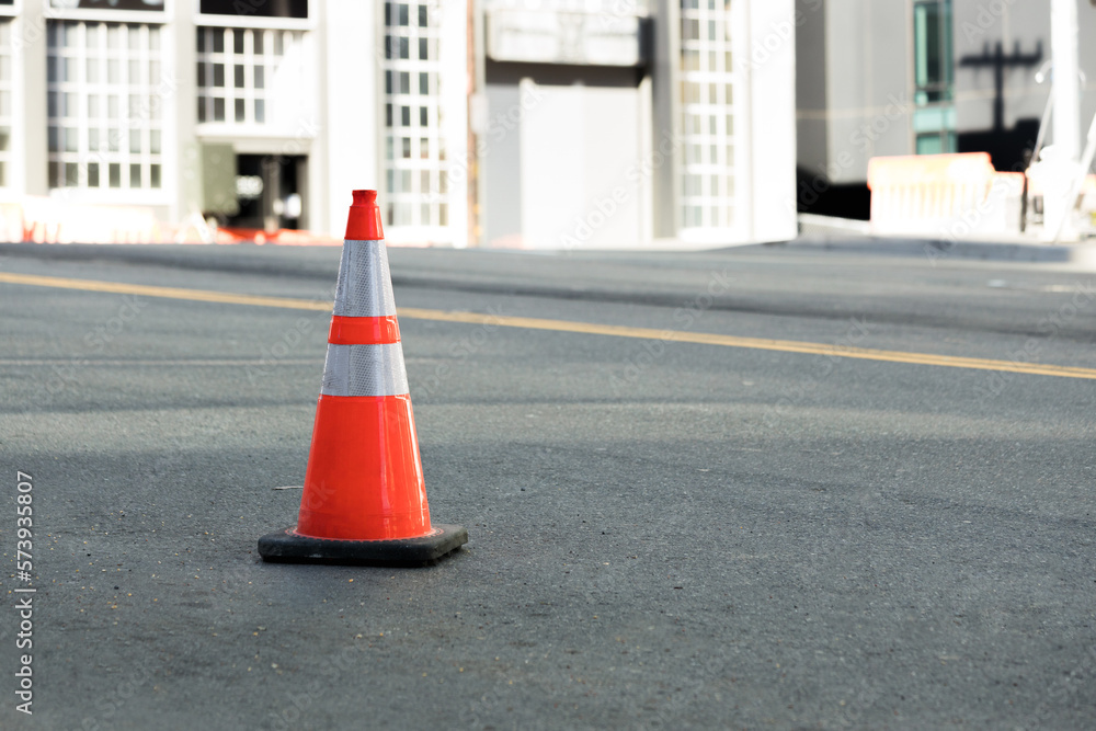 View of an empty street with an isolated construction cone. Concept of ...