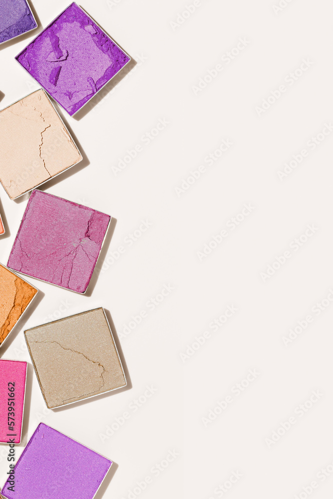 Multi-colored square swatches eyeshadows for makeup on beige background ...