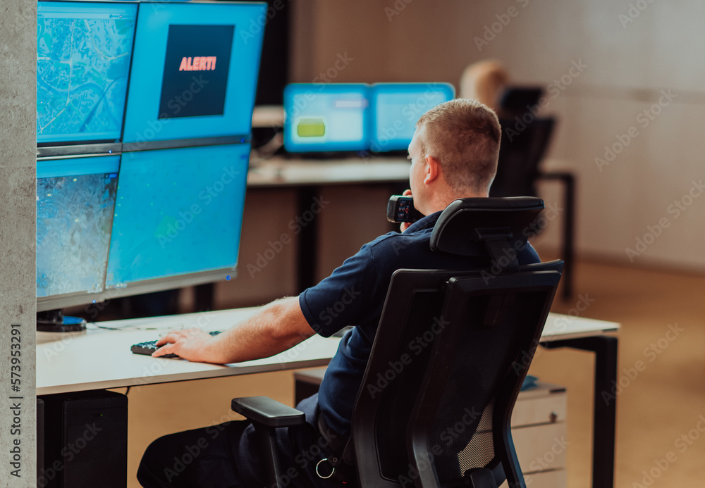 Group Of Security Data Center Operators Working In A Cctv Monitoring