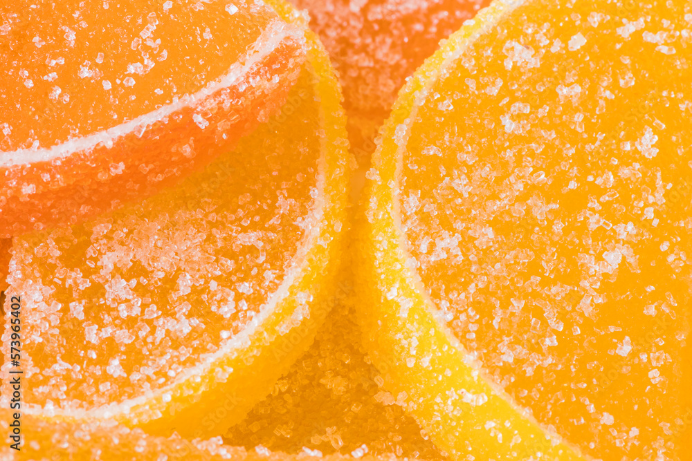 Decorative Background of yellow and orange marmalade candy in shape of ...