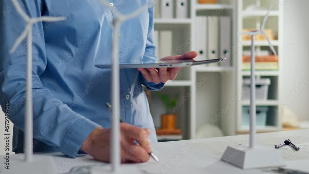 Windmill, Potential Investor Responsibly Sits at Planning Desk ...