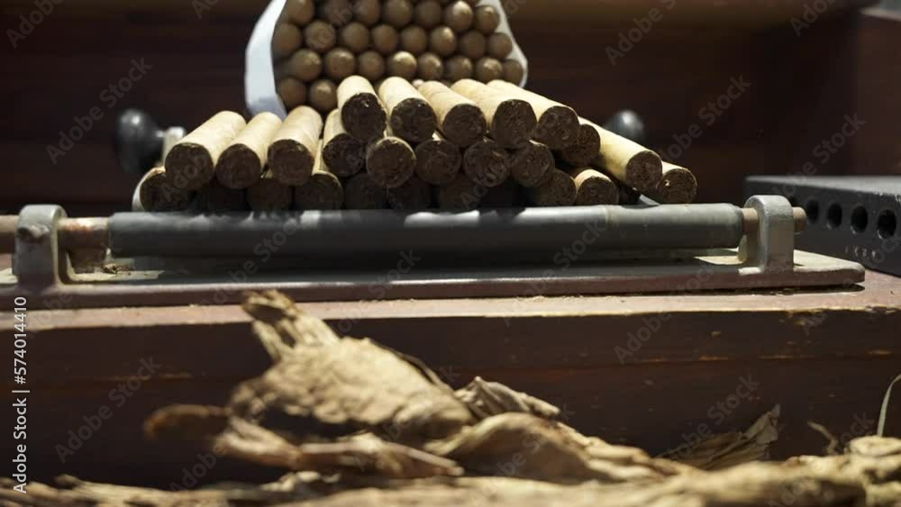 Stack hand rolled premium cuban cigars and dried tobacco leaves on ...