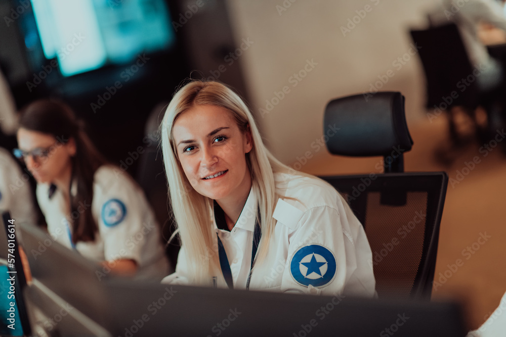 Group of Security data center operators working in a CCTV monitoring ...