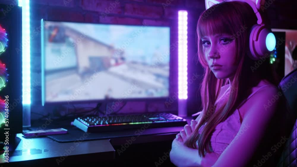 Cute and upset gamer girl sitting by PC with her hand crossed Stock ...
