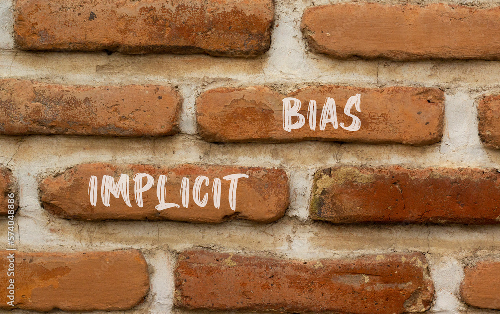 Implicit bias symbol. Concept words Implicit bias on red brown brick ...