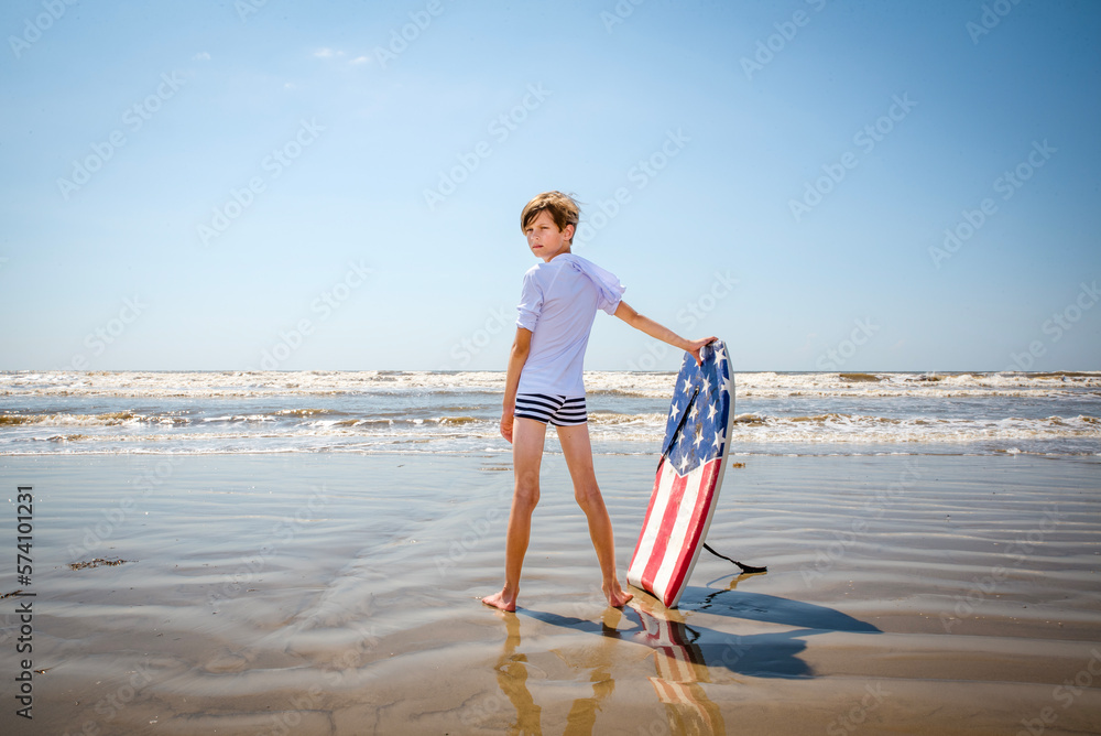 Youth Child Preteen Boy Standing on the Beach with A Boogie Board Stock ...