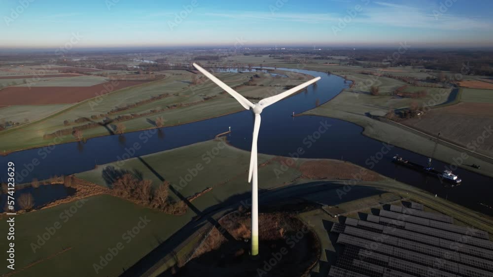 Single windmill and solar panel park in The Netherlands part of ...