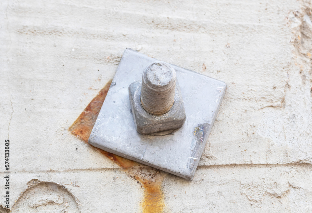 Old Metal male square nut screw nail heads attached concrete cement ...