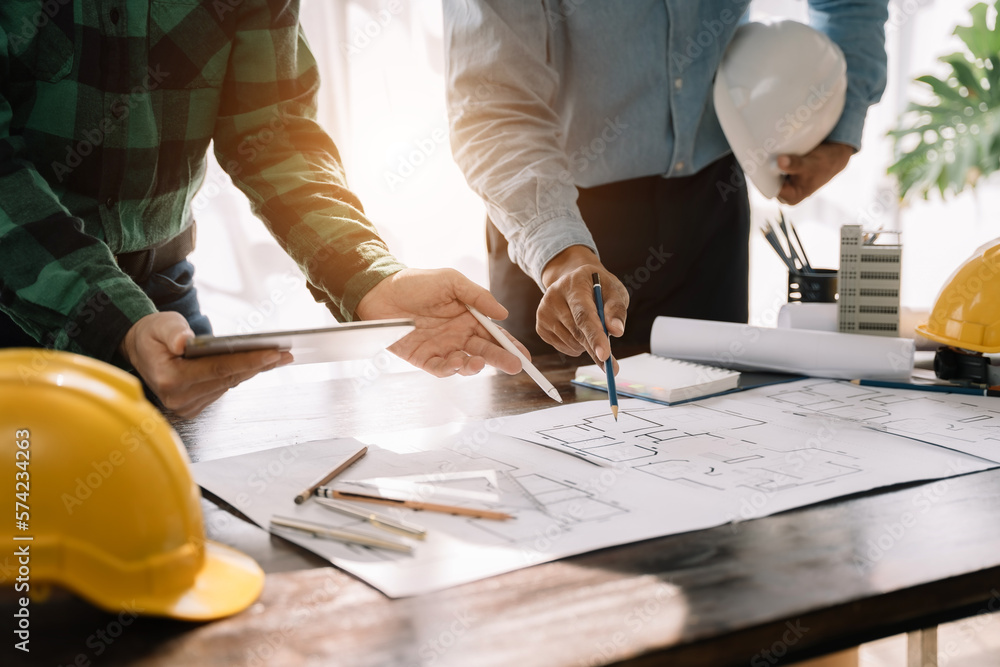 Engineer Teamwork Meeting, Drawing working on blueprint meeting for ...