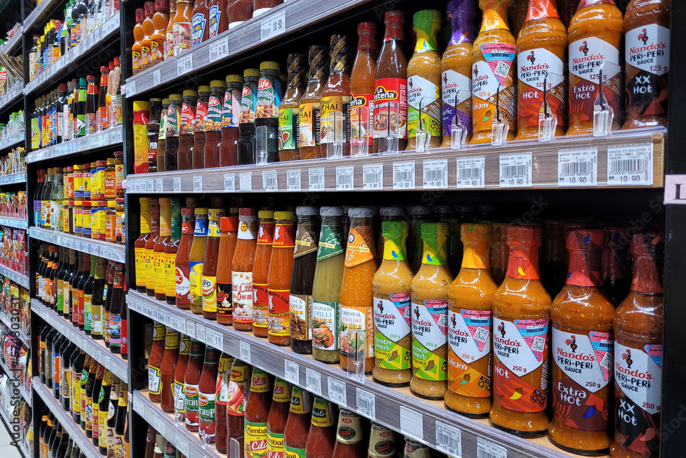 PENANG, MALAYSIA - 22 FEB 2023: Various brands of salad dressing, chili ...