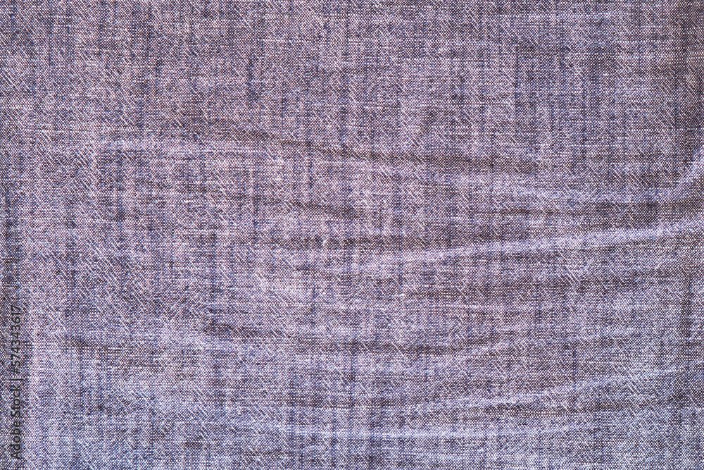Crumpled blue and purple denim background, detailed fabric texture with ...