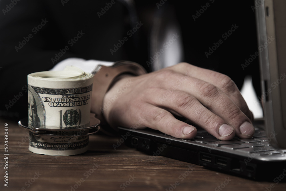 Foto de Money Addiction. Businessman works in an office. His hand is ...