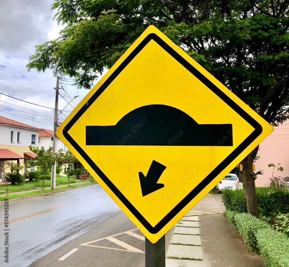 Traffic sign indicating bump or speed bump. Advises the vehicle driver ...