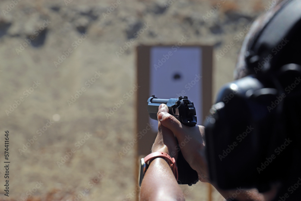 Fixed target gunshot. Target shooting with a pistol, practice at the ...