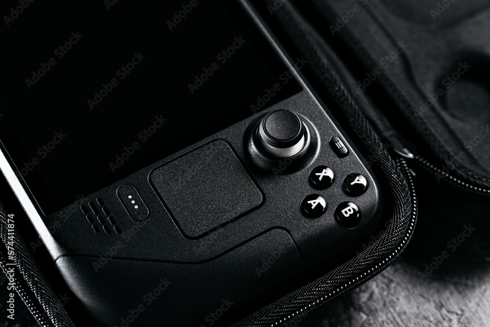 New Valve Steam Deck portable gaming console on black table. Kyiv ...