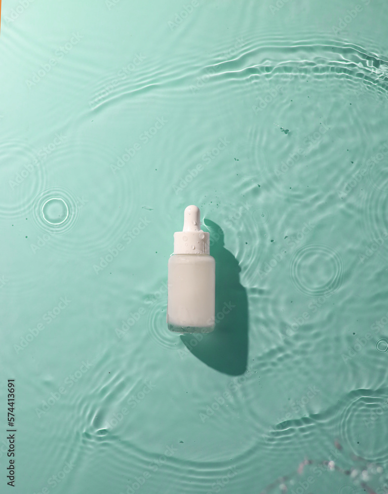 Skin care product mock up on water surface. Water ripples from top ...
