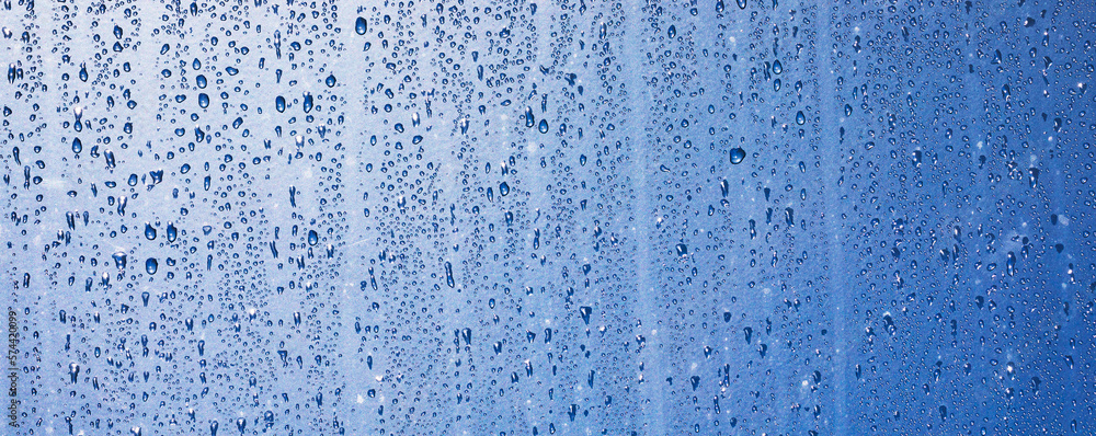 water drops on a window or in the shower cabin,wet transparent panorama ...