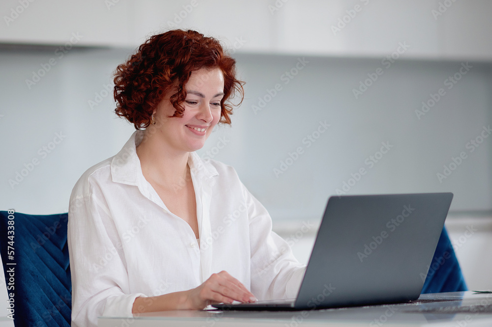 Beauitul young woman working using computer laptop concentrated and ...