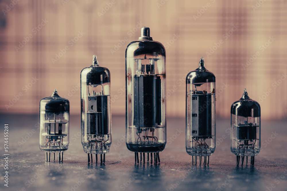 Old diode lamps of different sizes on a table, closeup. Several ...