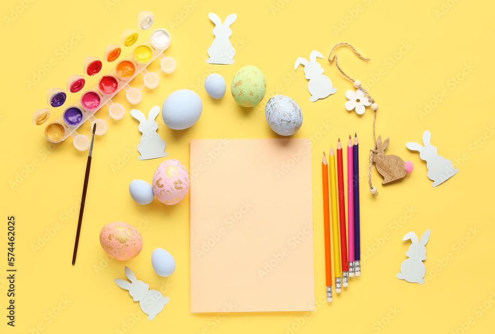 Blank paper sheet with paints, pencils, Easter eggs and rabbits on ...