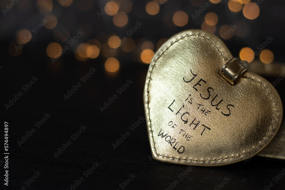 Jesus is the light of the world, handwritten text verse on shiny golden ...