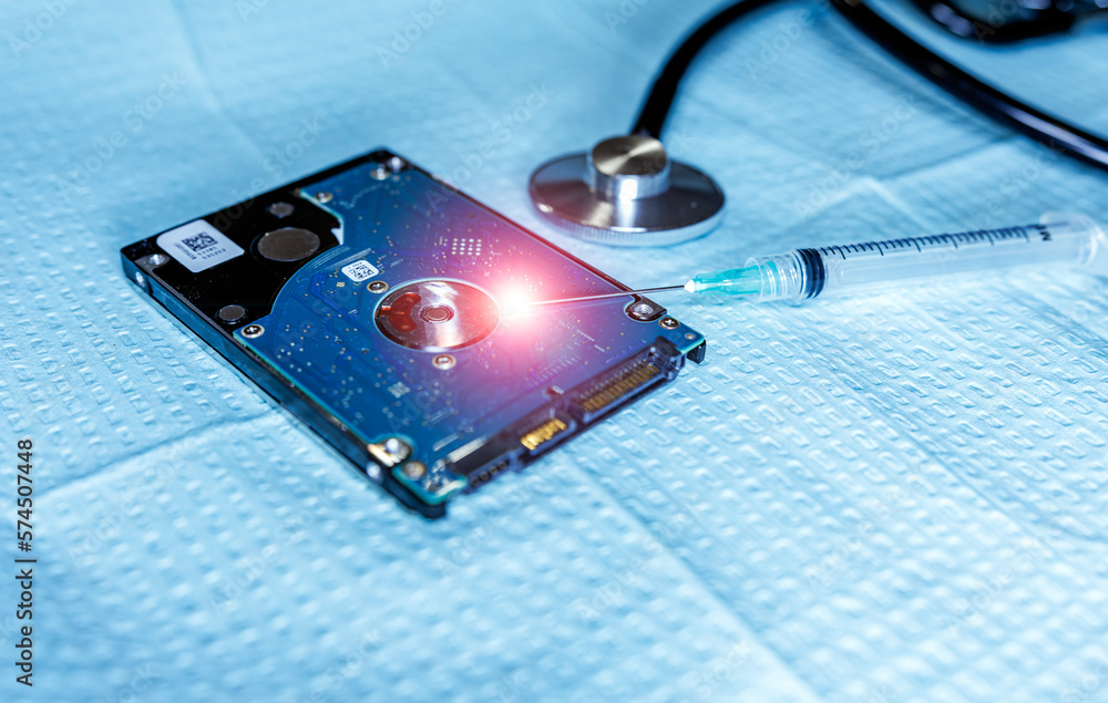 Medical tray with stethoscope, needles, and disk drive symbolizing ...