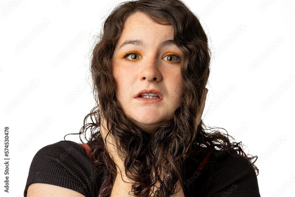 Young woman clinching her face with frustration and stress, on white ...