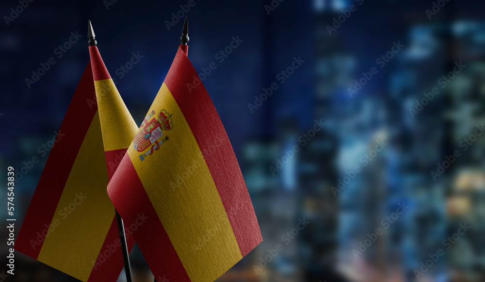 A small Spain flag on an abstract blurry background Stock Photo | Adobe ...