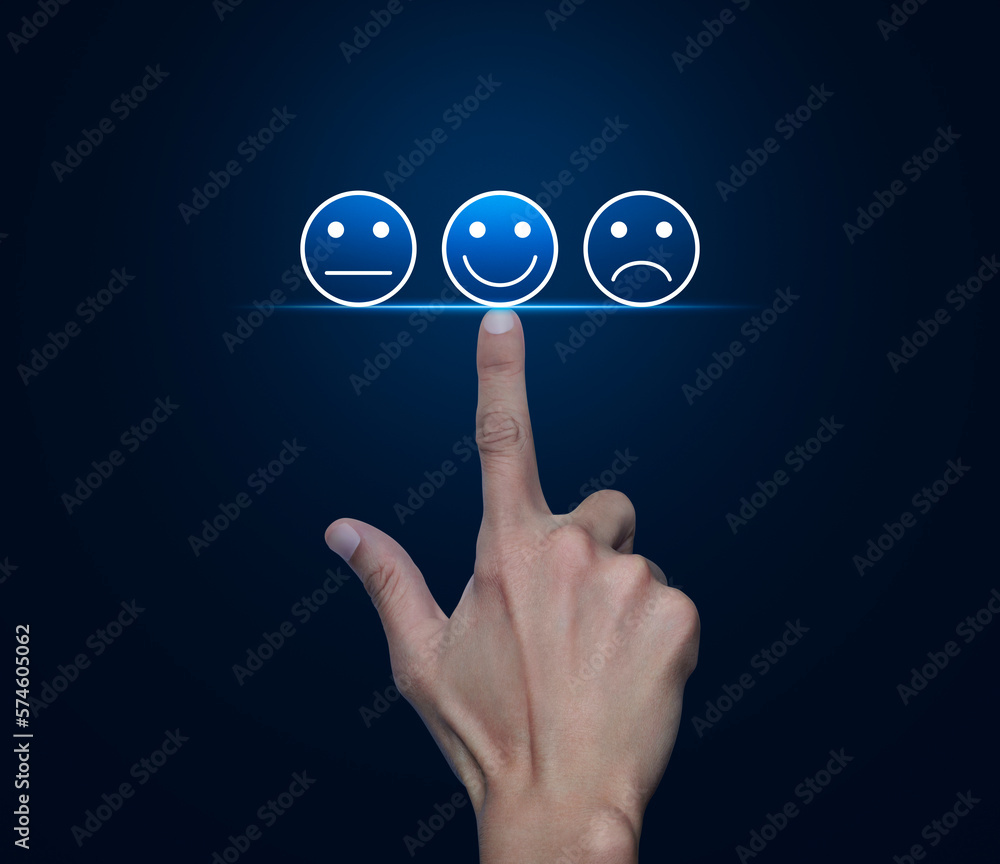 Hand pressing excellent smiley face rating icon over light blue ...
