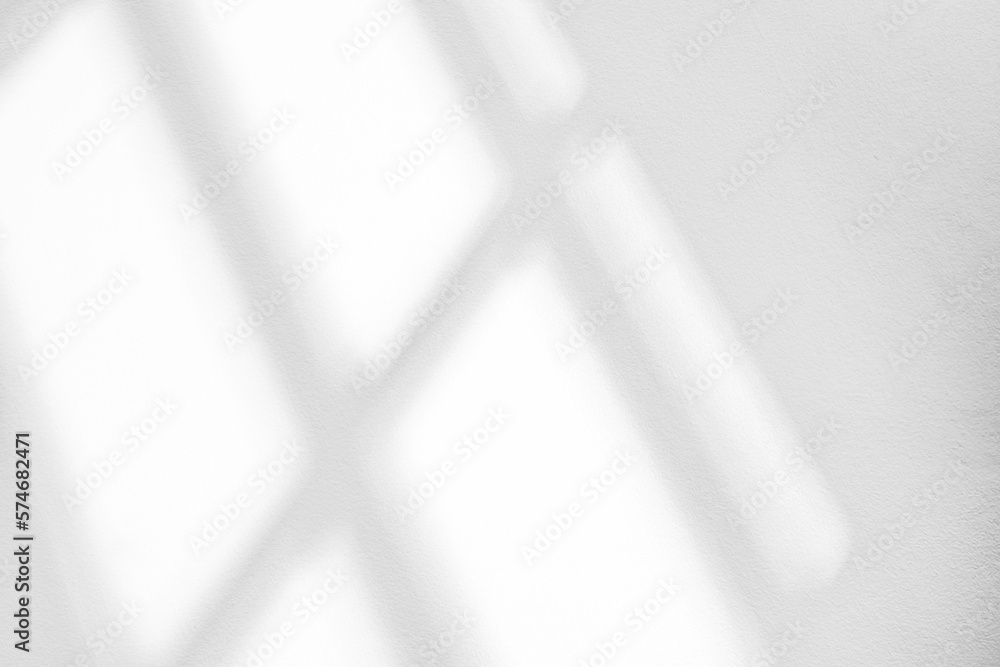 Abstract light reflection and grey shadow from window on white wall ...