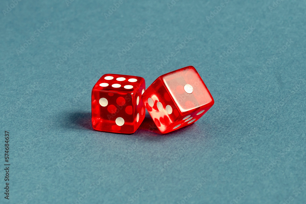Random number generator. Two red dice with numerical values lie in a ...